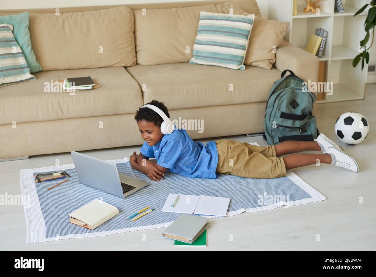 Black african child watching video hi-res stock photography and images ...