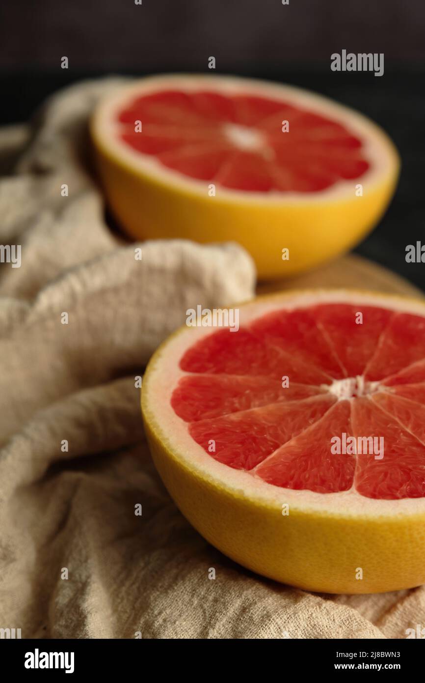 sliced ripe grapefruit on a light cloth Stock Photo - Alamy