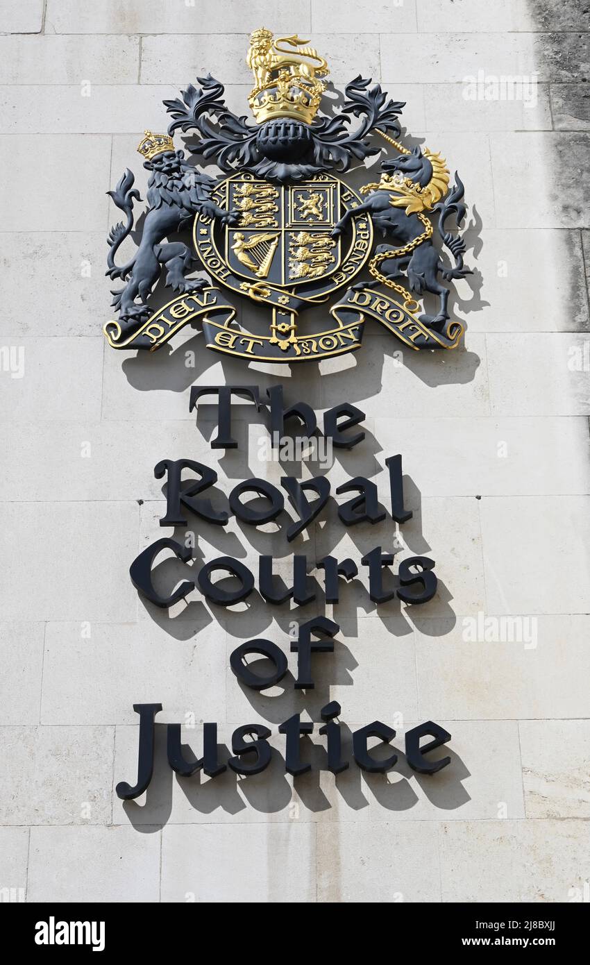 The Royal Courts of Justice sign with the Coat of Arms of the United ...
