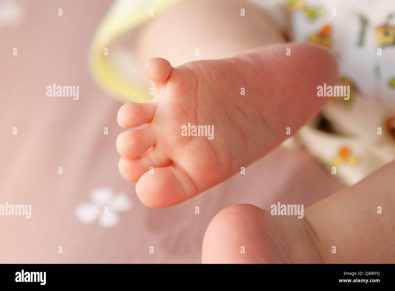 Small human child legs with fingers Stock Photo - Alamy