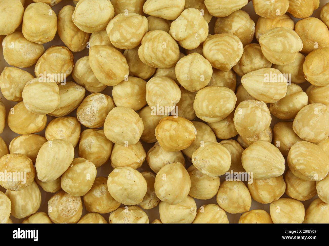 Full frame of golden color roasted hazelnuts. Texture background Stock ...