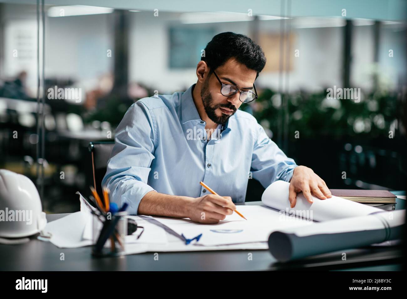 Busy smart attractive millennial arabic male engineer architect with ...