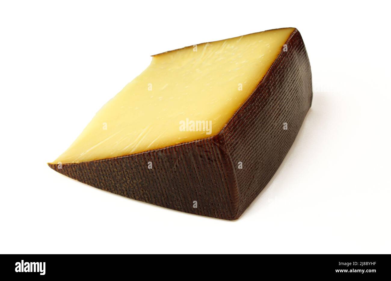 Smoked triangle shaped cheese isolated on white background Stock Photo ...