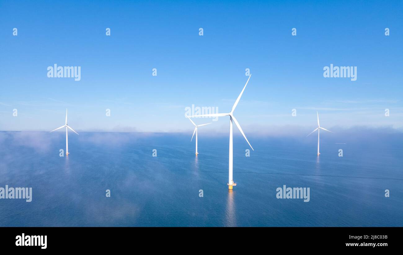 Offshore Windmill farm in the ocean Westermeerwind park, windmills ...