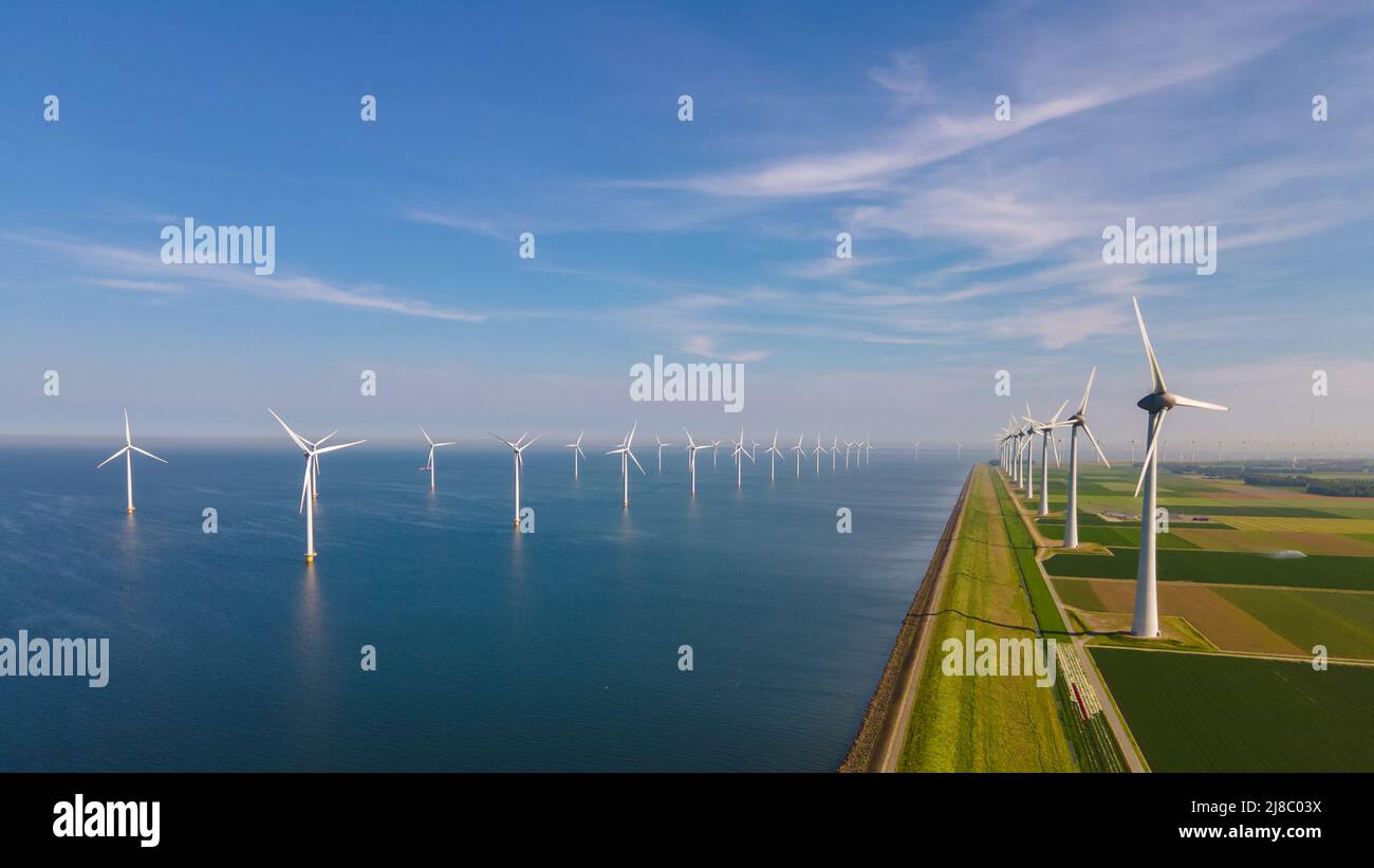 Offshore Windmill farm in the ocean Westermeerwind park, windmills ...