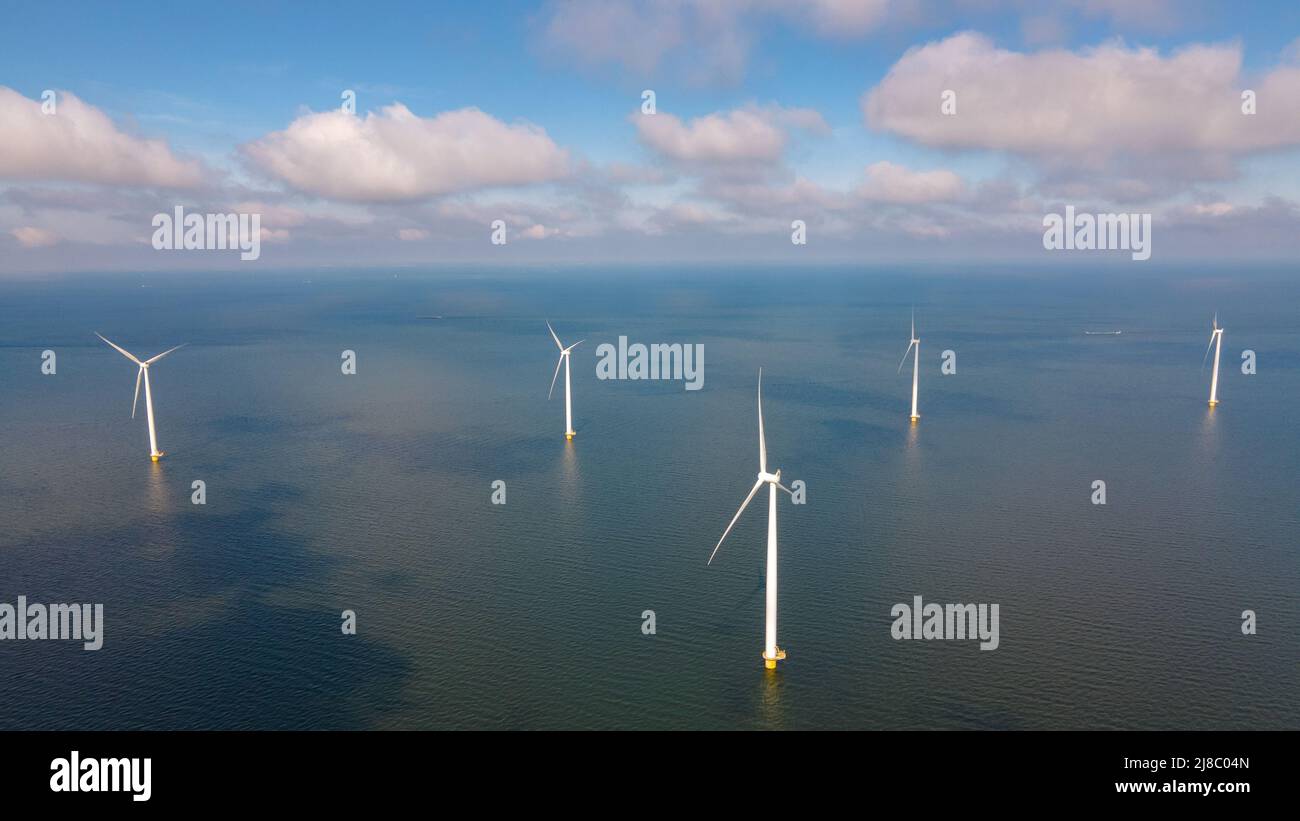 Offshore Windmill farm in the ocean Westermeerwind park, windmills ...