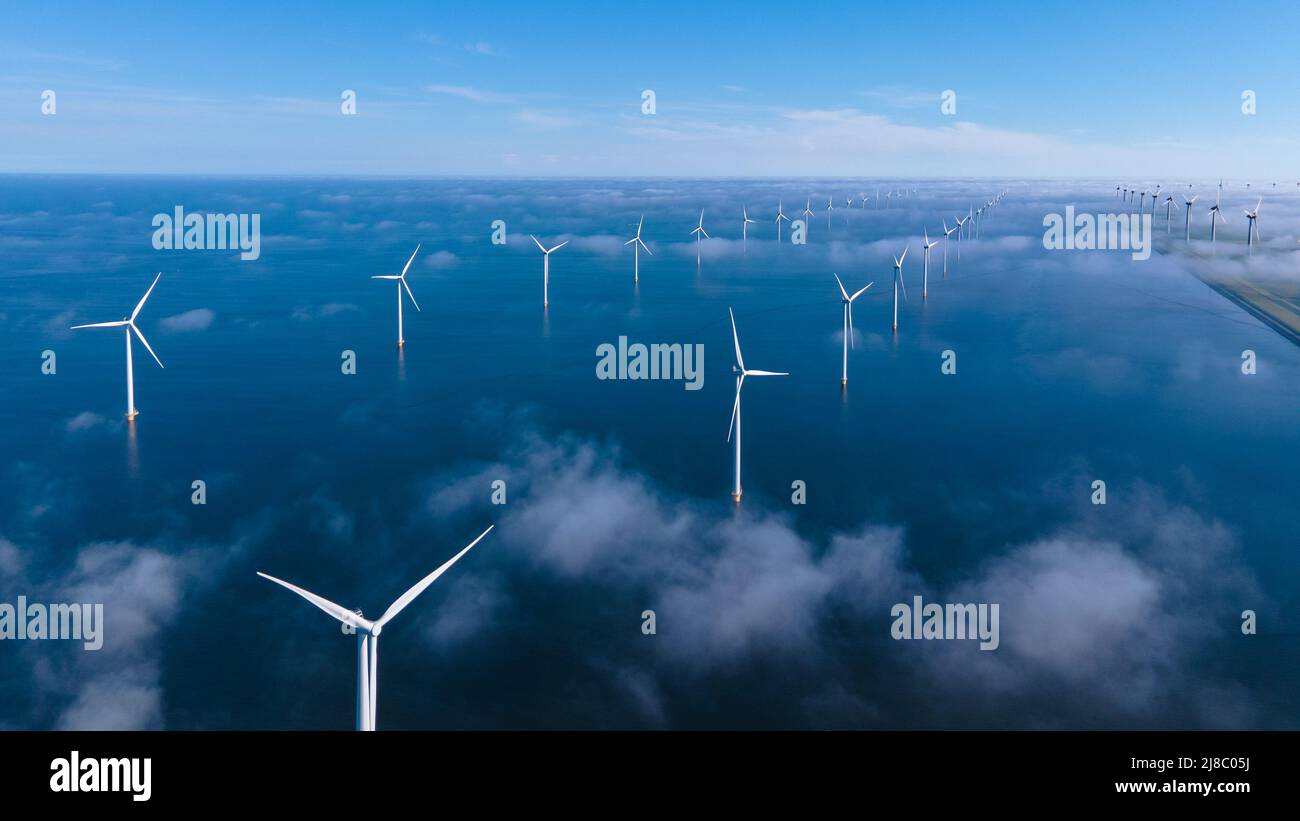 Offshore Windmill farm in the ocean Westermeerwind park, windmills ...