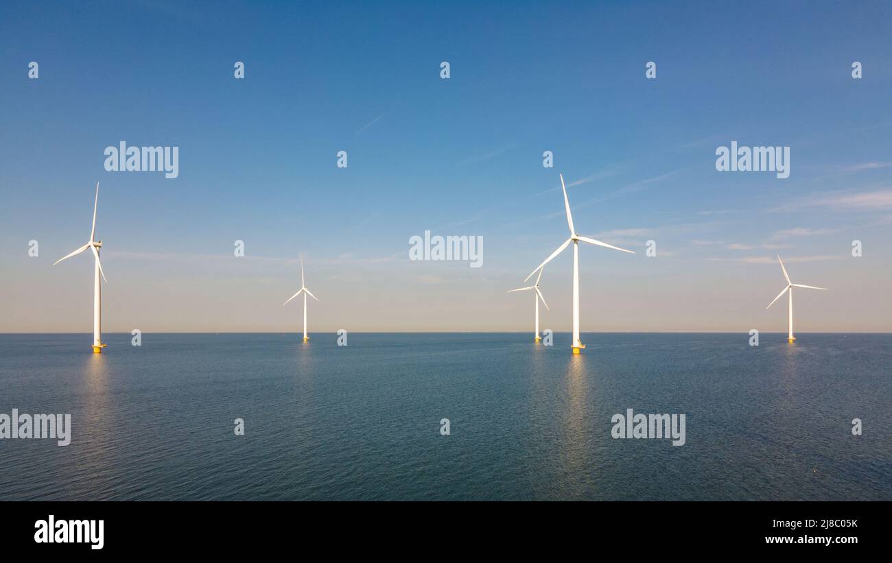Offshore Windmill farm in the ocean Westermeerwind park, windmills ...