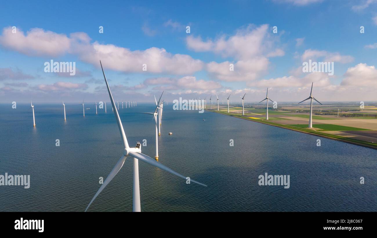 Offshore Windmill farm in the ocean Westermeerwind park, windmills ...