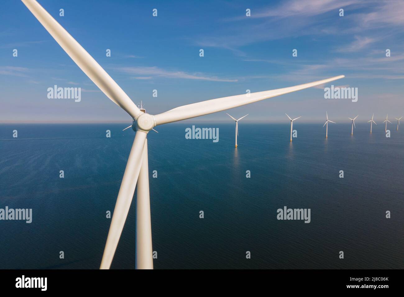 Offshore Windmill farm in the ocean Westermeerwind park, windmills ...