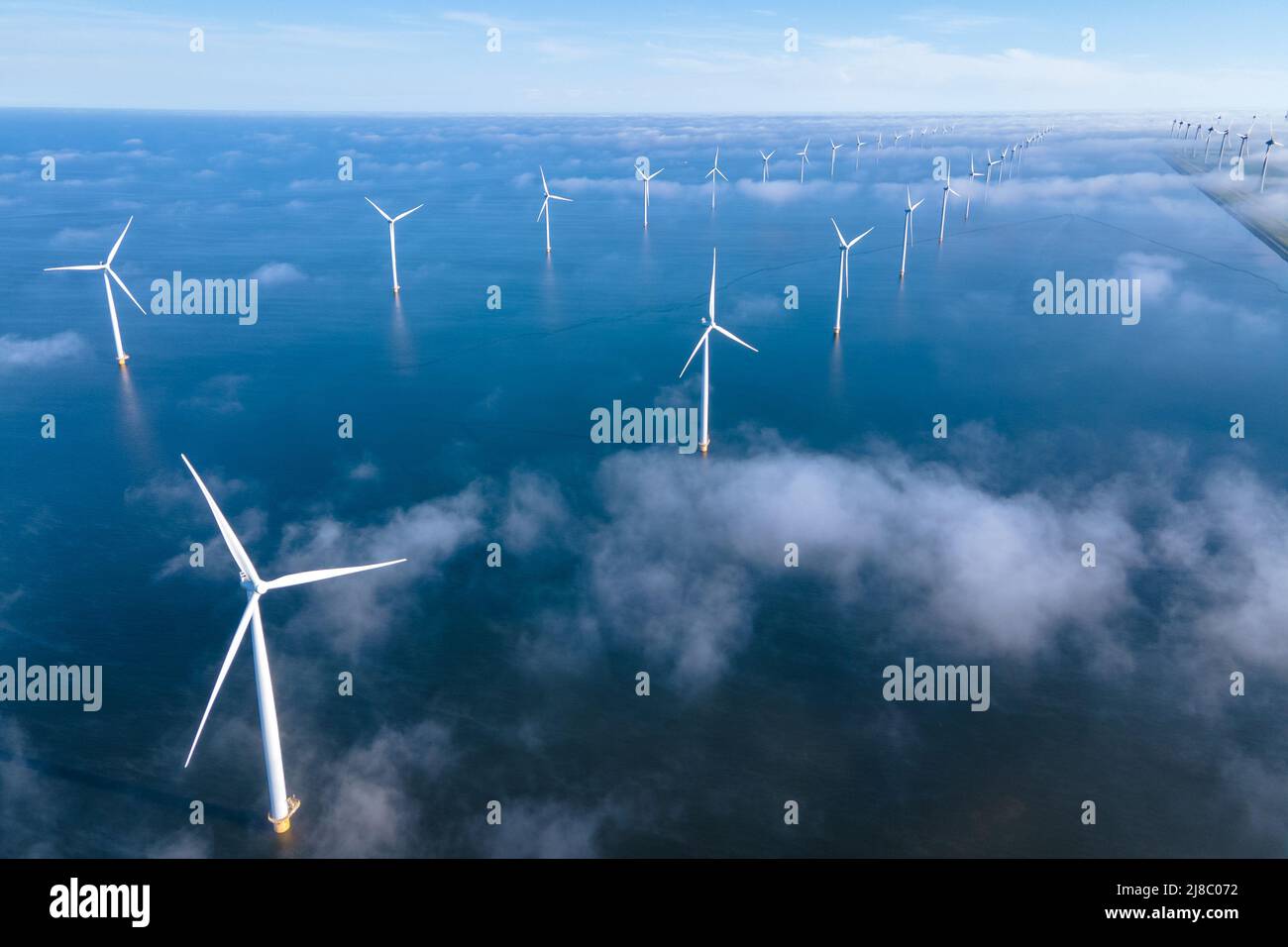 Offshore Windmill farm in the ocean Westermeerwind park, windmills ...