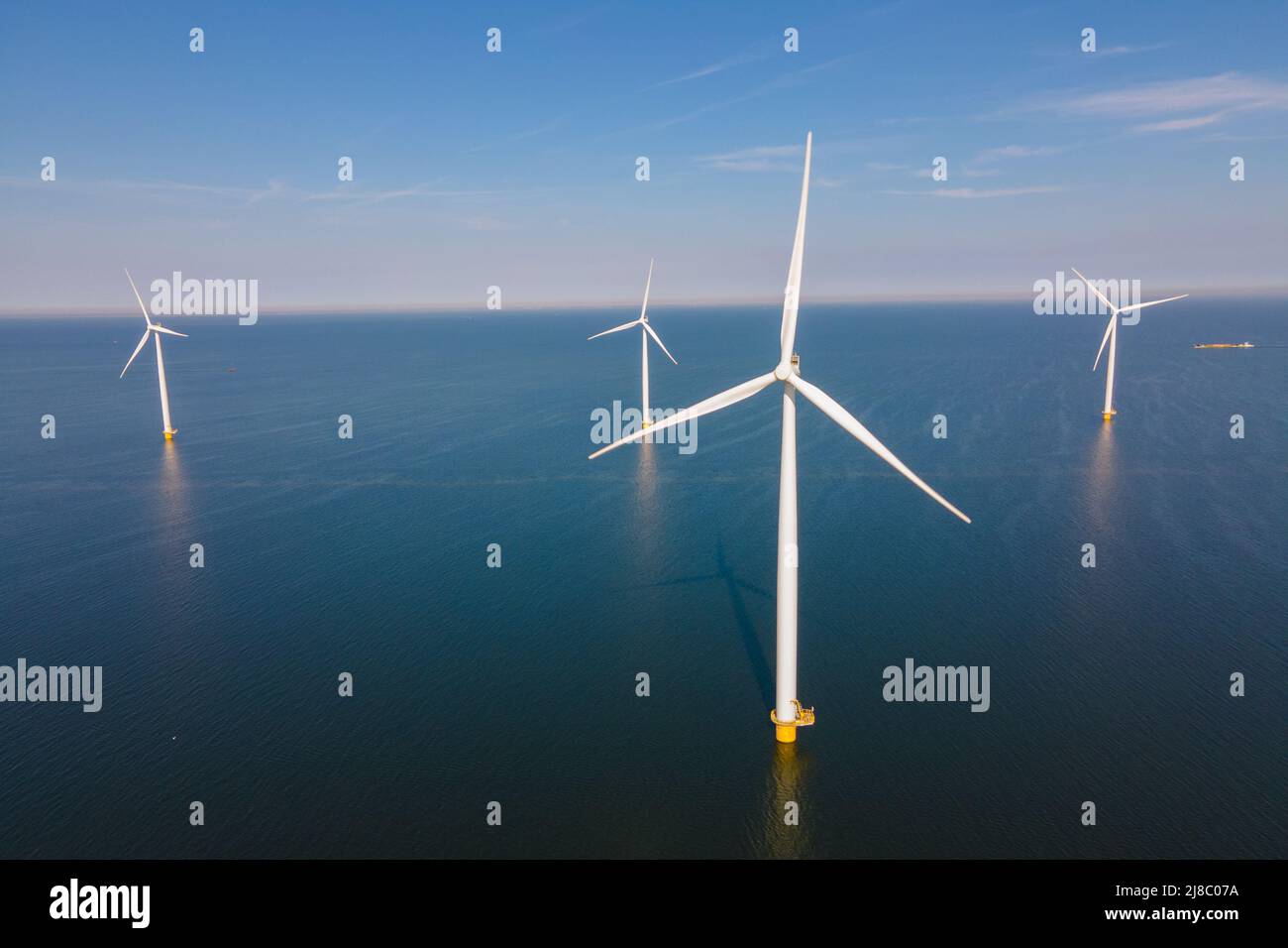 Offshore Windmill farm in the ocean Westermeerwind park, windmills ...