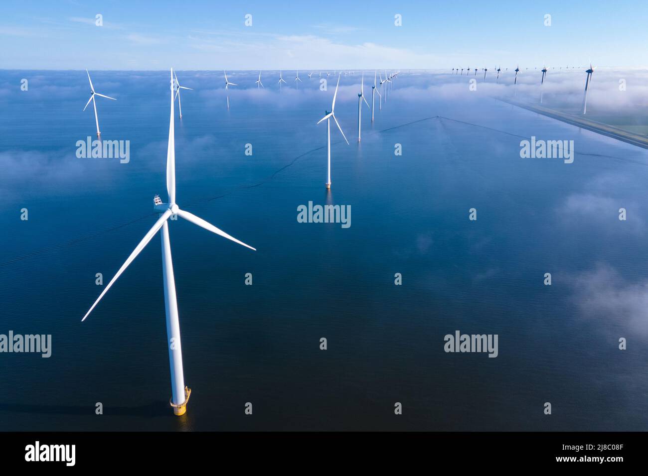Offshore Windmill farm in the ocean Westermeerwind park, windmills ...