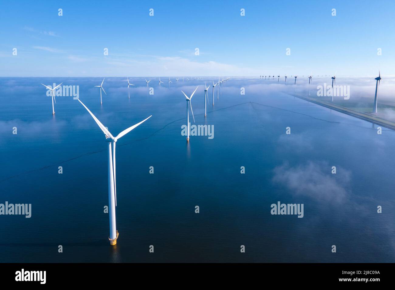 Offshore Windmill farm in the ocean Westermeerwind park, windmills ...