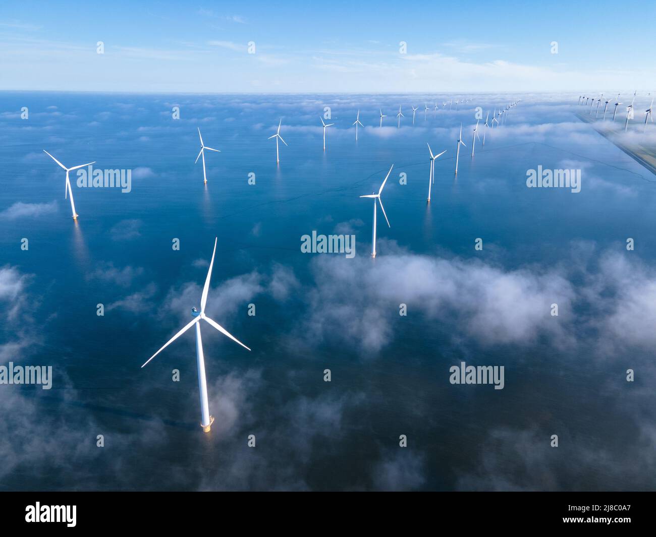 Offshore Windmill farm in the ocean Westermeerwind park, windmills ...