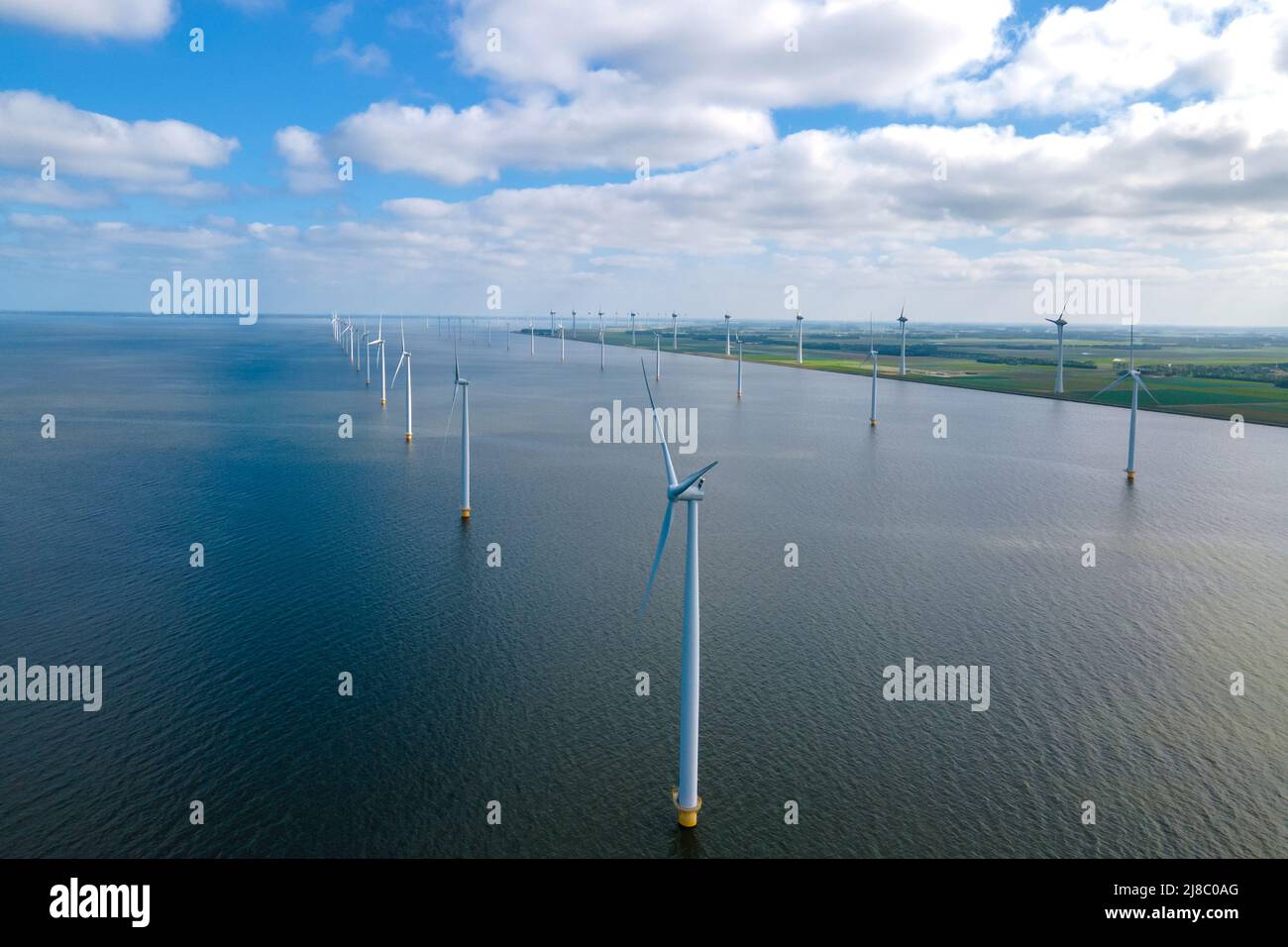 Offshore Windmill farm in the ocean Westermeerwind park, windmills ...