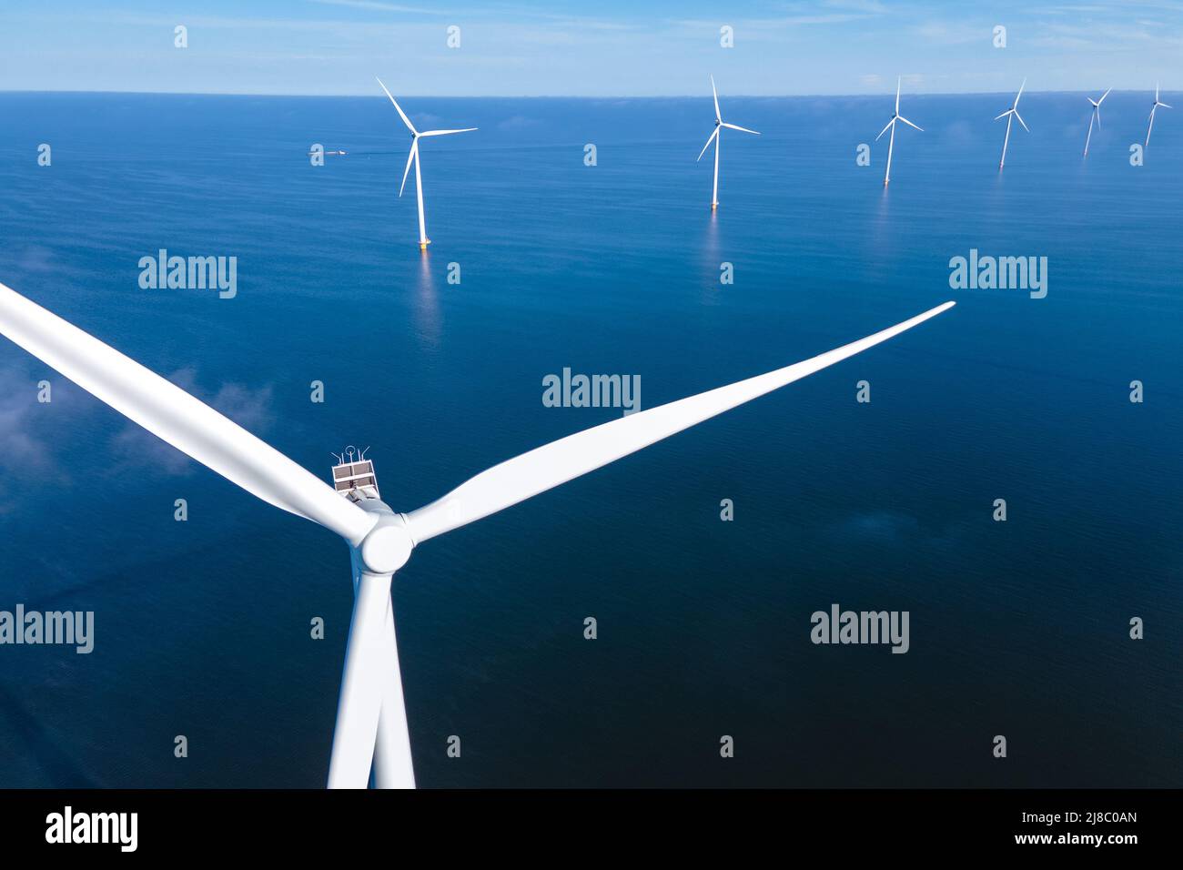 Offshore Windmill farm in the ocean Westermeerwind park, windmills ...