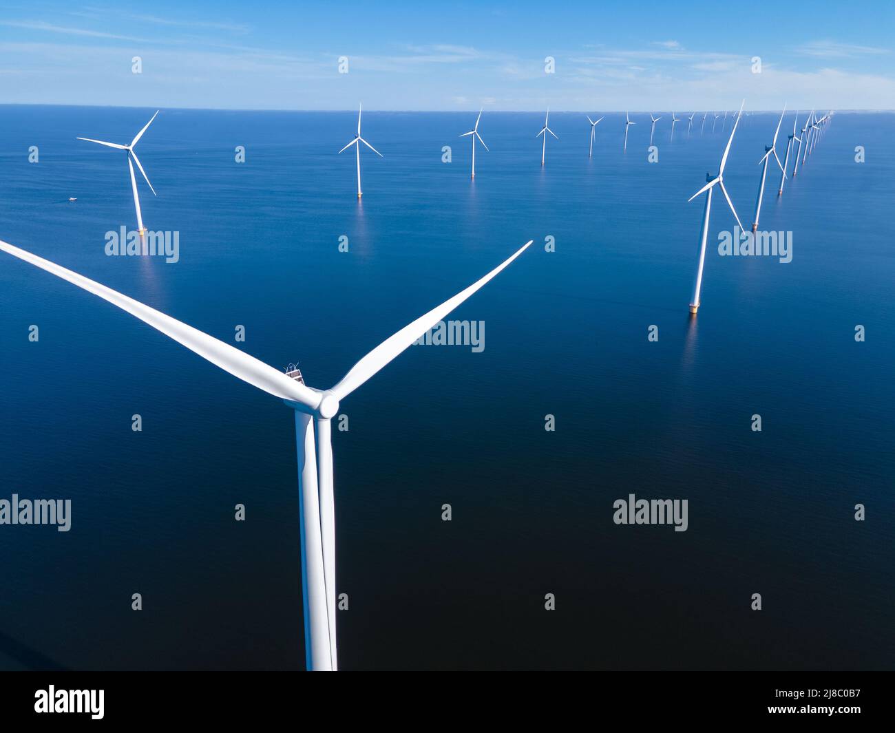 Offshore Windmill farm in the ocean Westermeerwind park, windmills ...