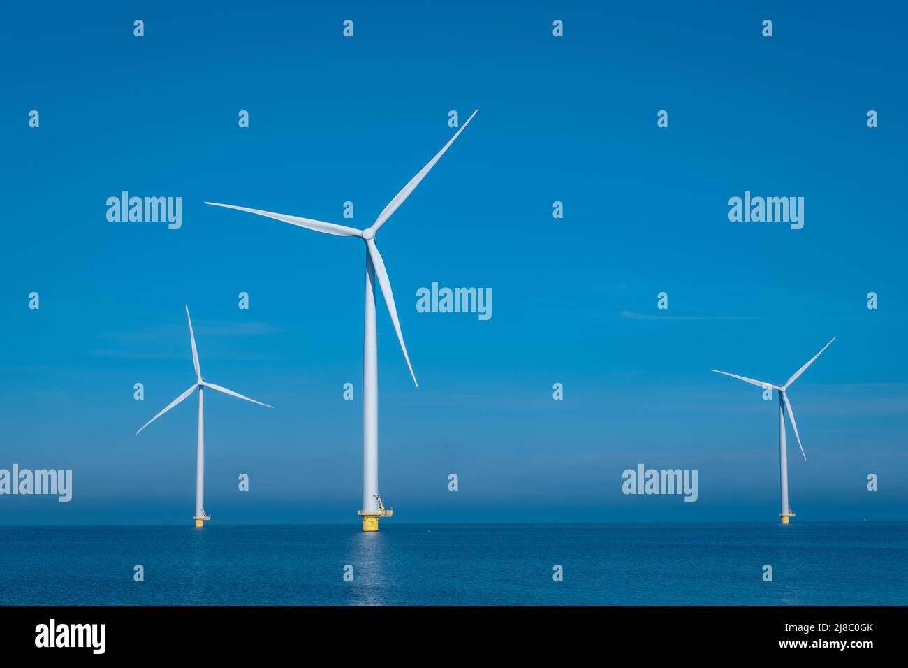 Offshore Windmill farm in the ocean Westermeerwind park, windmills ...