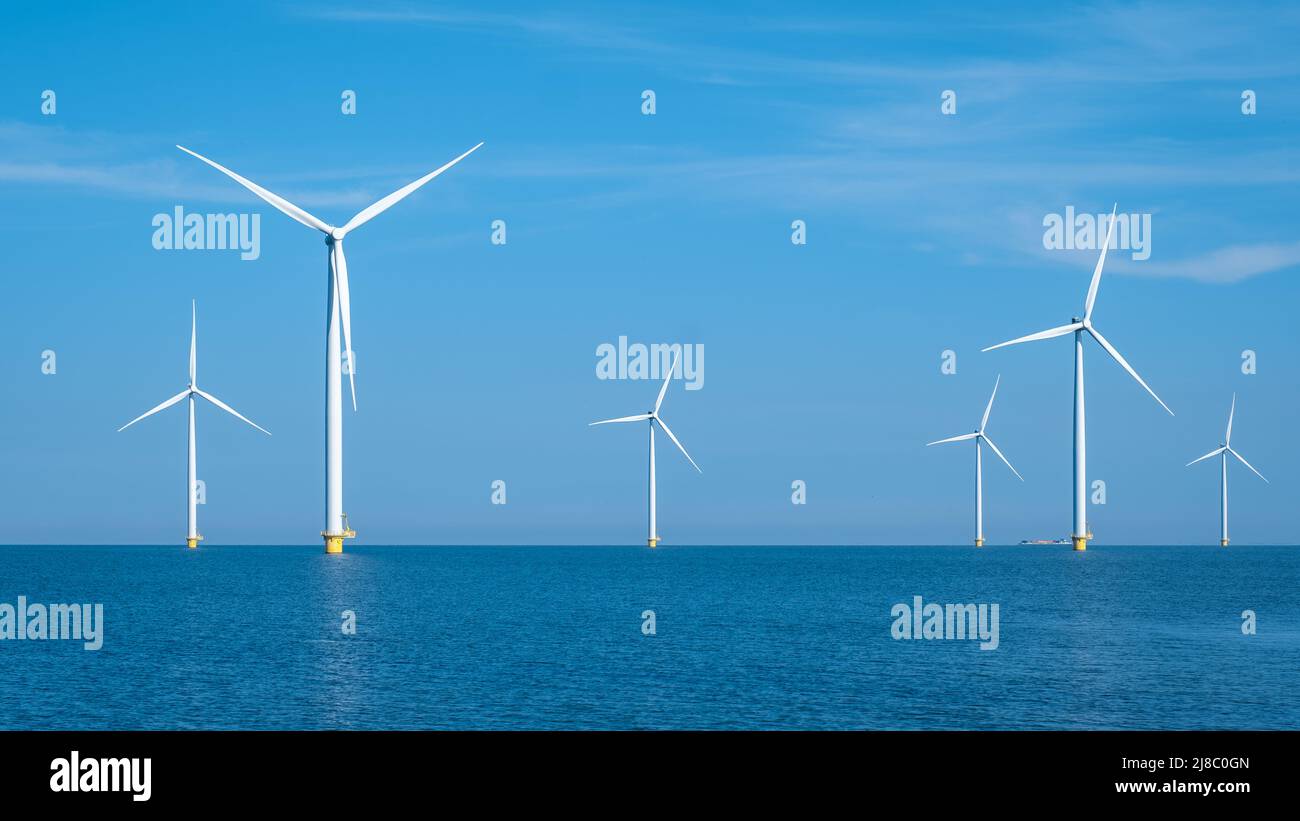 Offshore Windmill farm in the ocean Westermeerwind park, windmills ...