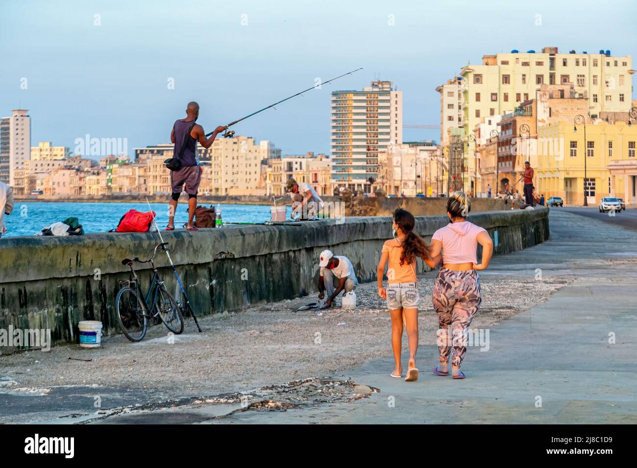 Cuban people fishing in El Malecon, Havana, Cuba Stock Photo - Alamy