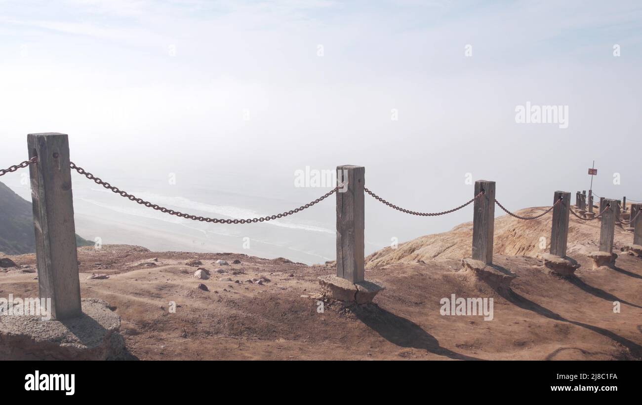 Steep unstable cliff, rock or bluff, foggy weather, California coast ...