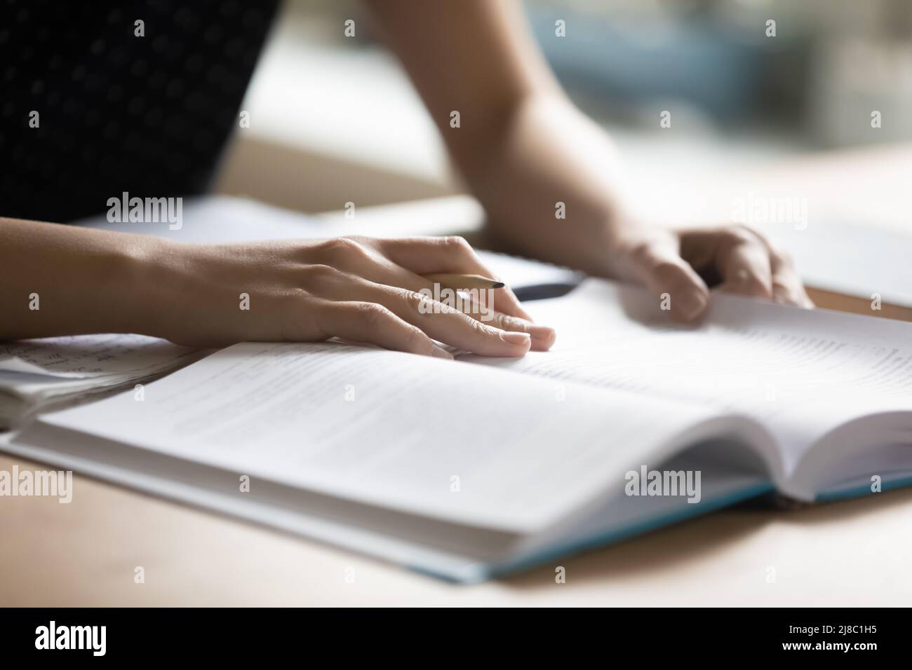 Student preparing for college test, exam, reading book Stock Photo - Alamy