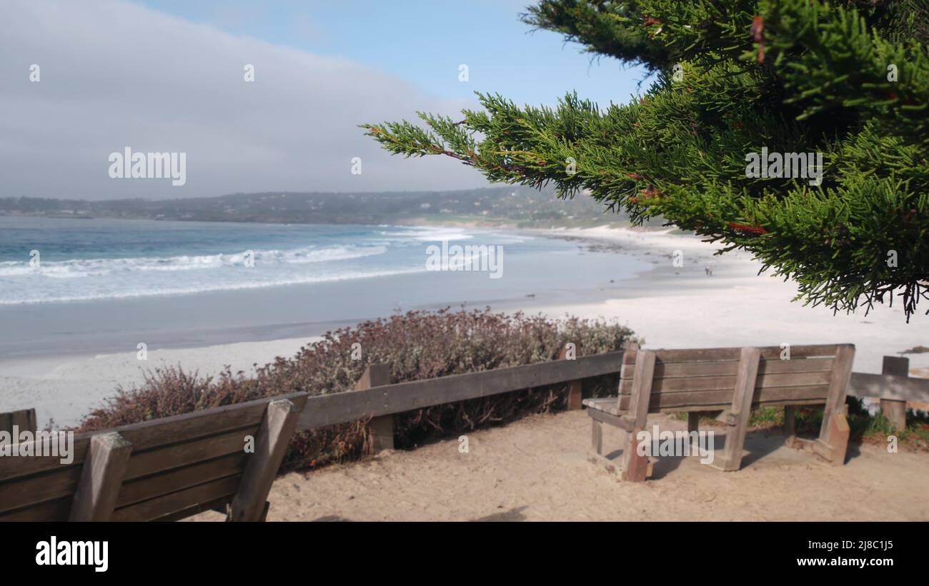 Empty wooden bench, rest on trail path, walkway or footpath. Carmel ...