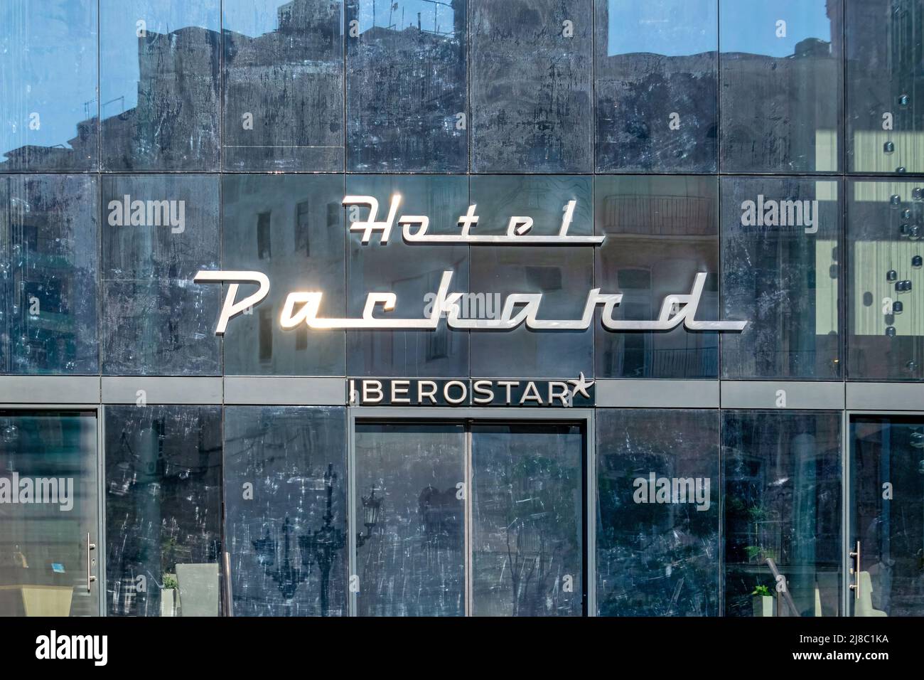 Business entrance sign of the Hotel Packard by Iberostar. The text is ...