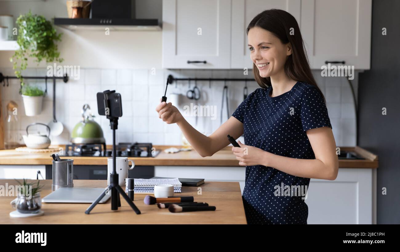 Happy young beauty blogger girl reviewing cosmetics for makeup Stock ...