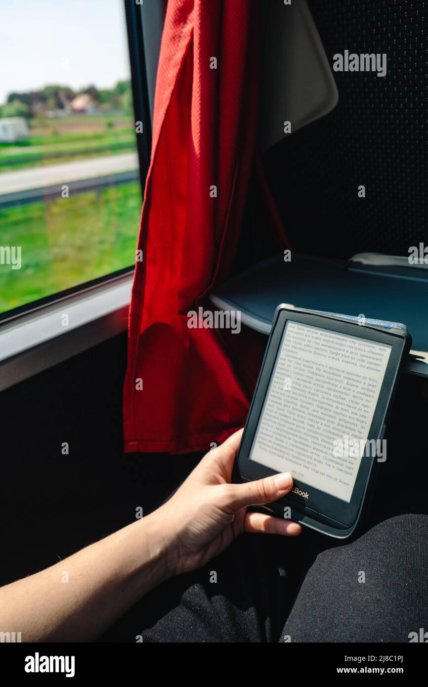 reading book in bus road trip concept Stock Photo - Alamy