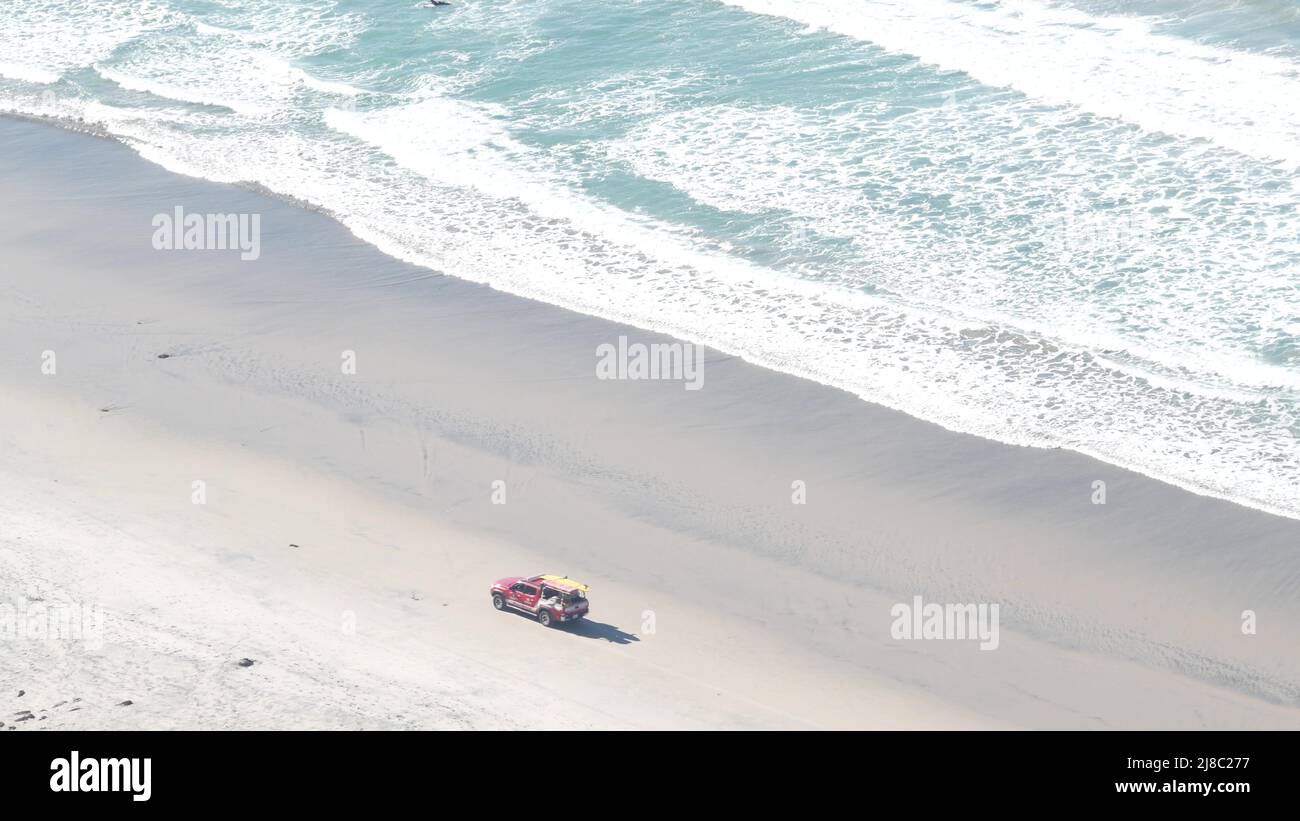 Lifeguard red pickup truck, life guard auto on sand, California ocean ...