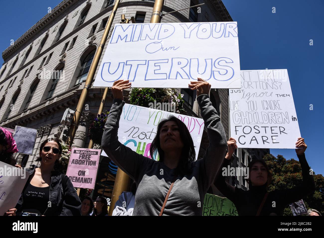 Pro-choice protestors rallying for reproductive rights with their signs ...