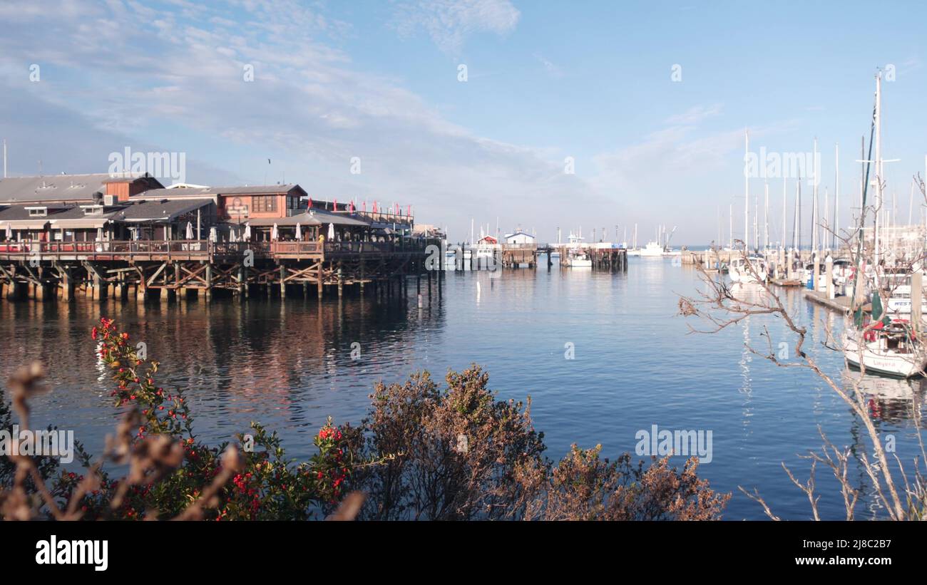 Colorful wooden houses on piles, pillars or pylons, ocean sea water ...