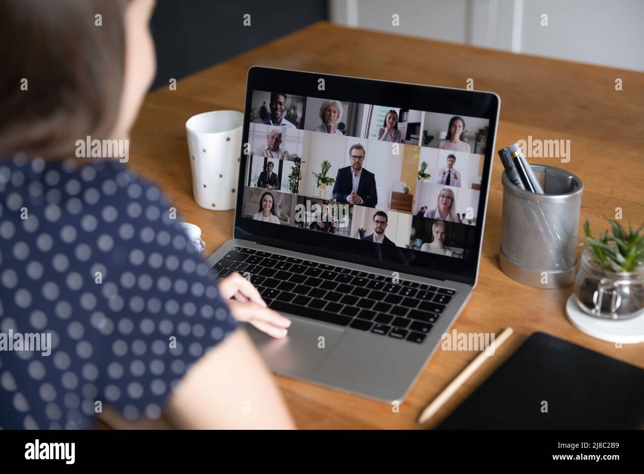 Freelance remote employee girl talking on video conference call Stock ...