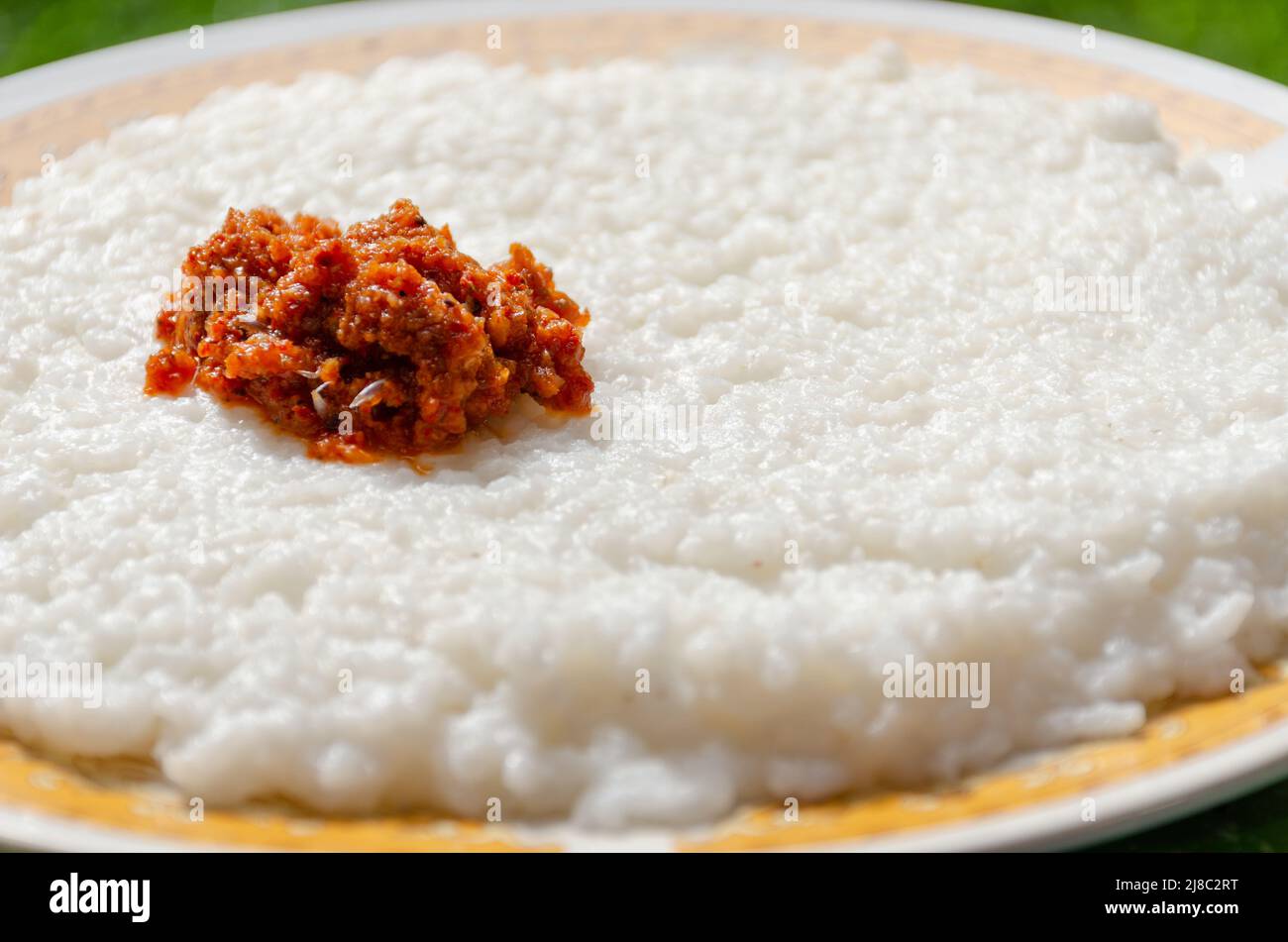 Milk rice with spicy chili sambal on a plate - Sri Lankan traditional ...
