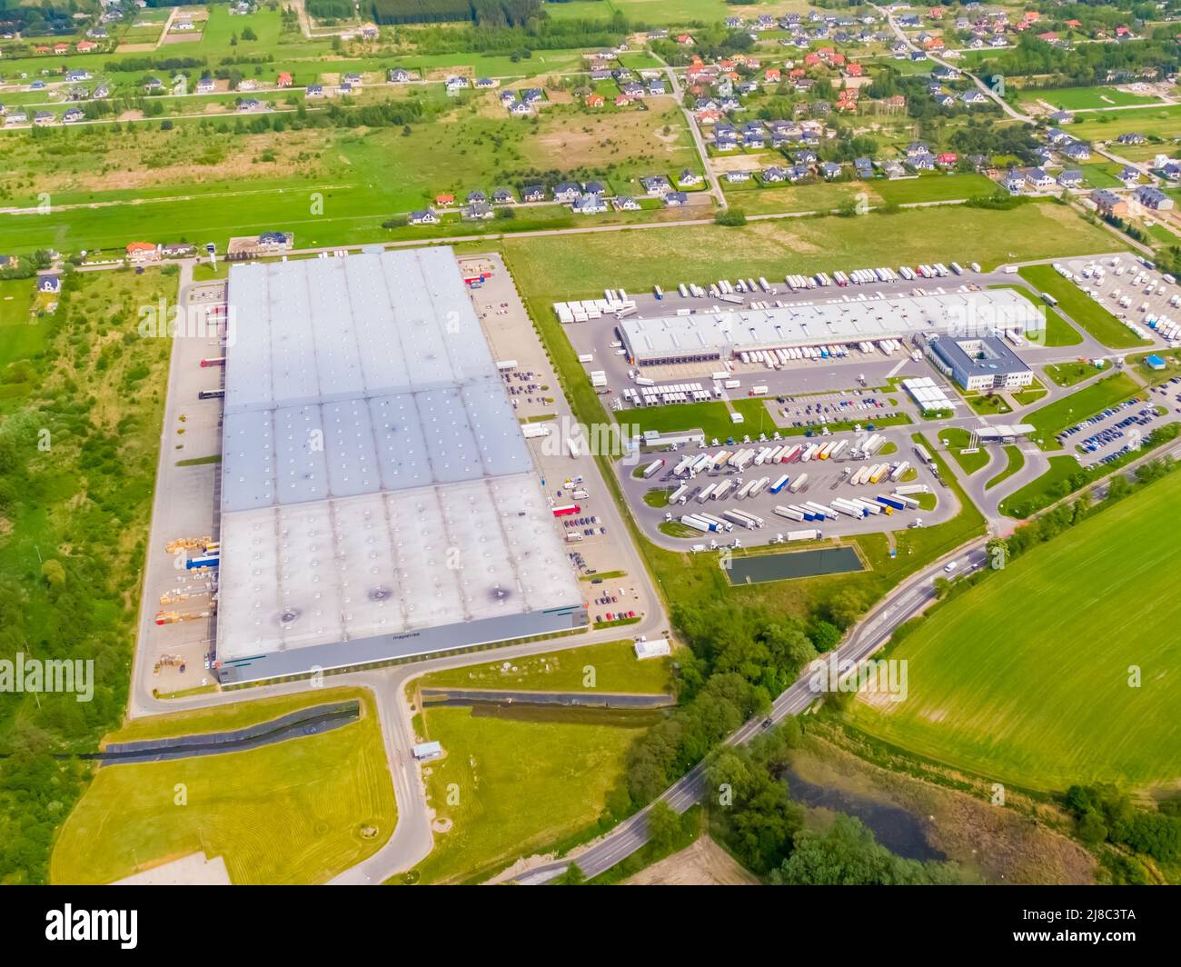 Aerial view of a logistics park with warehouse, loading hub and many ...