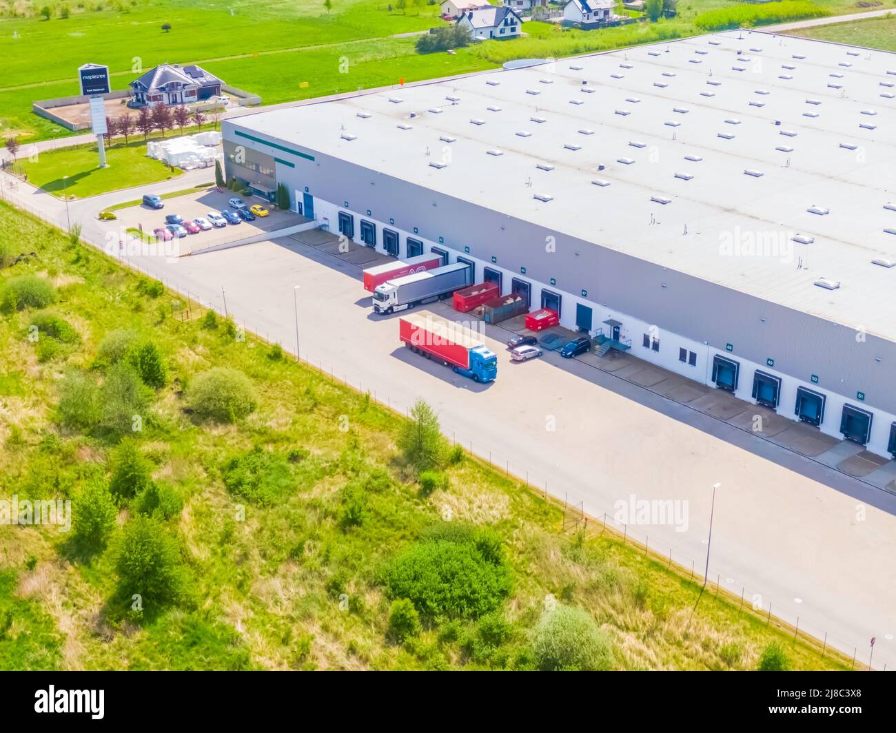 Aerial view of a logistics park with warehouse, loading hub and many ...