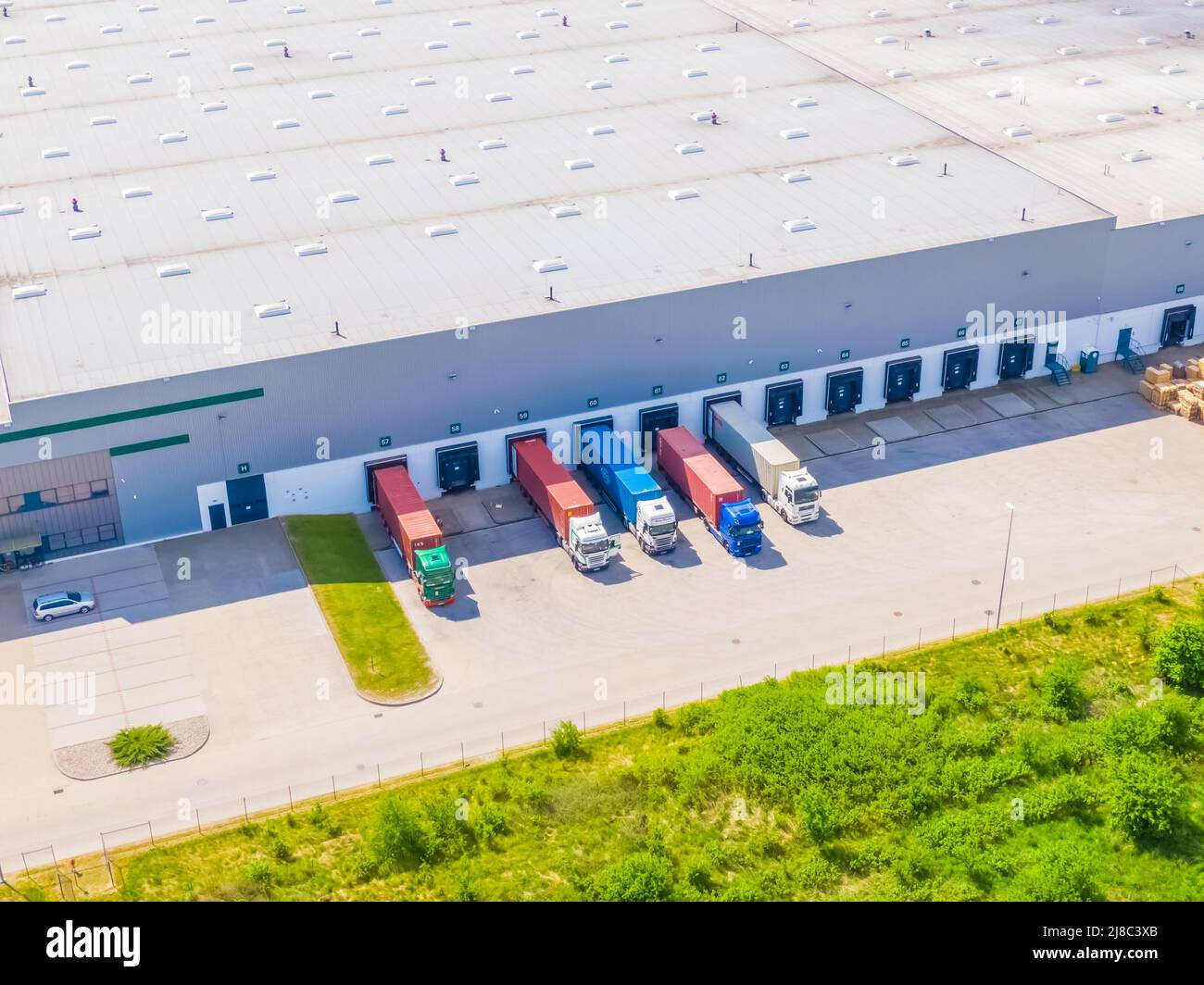 Aerial view of a logistics park with warehouse, loading hub and many ...