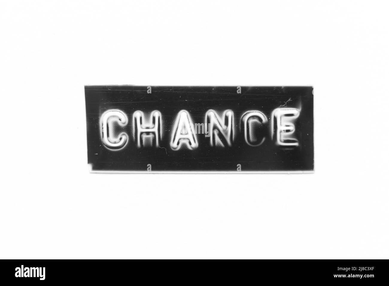 Black color banner that have embossed letter with word chance on white ...