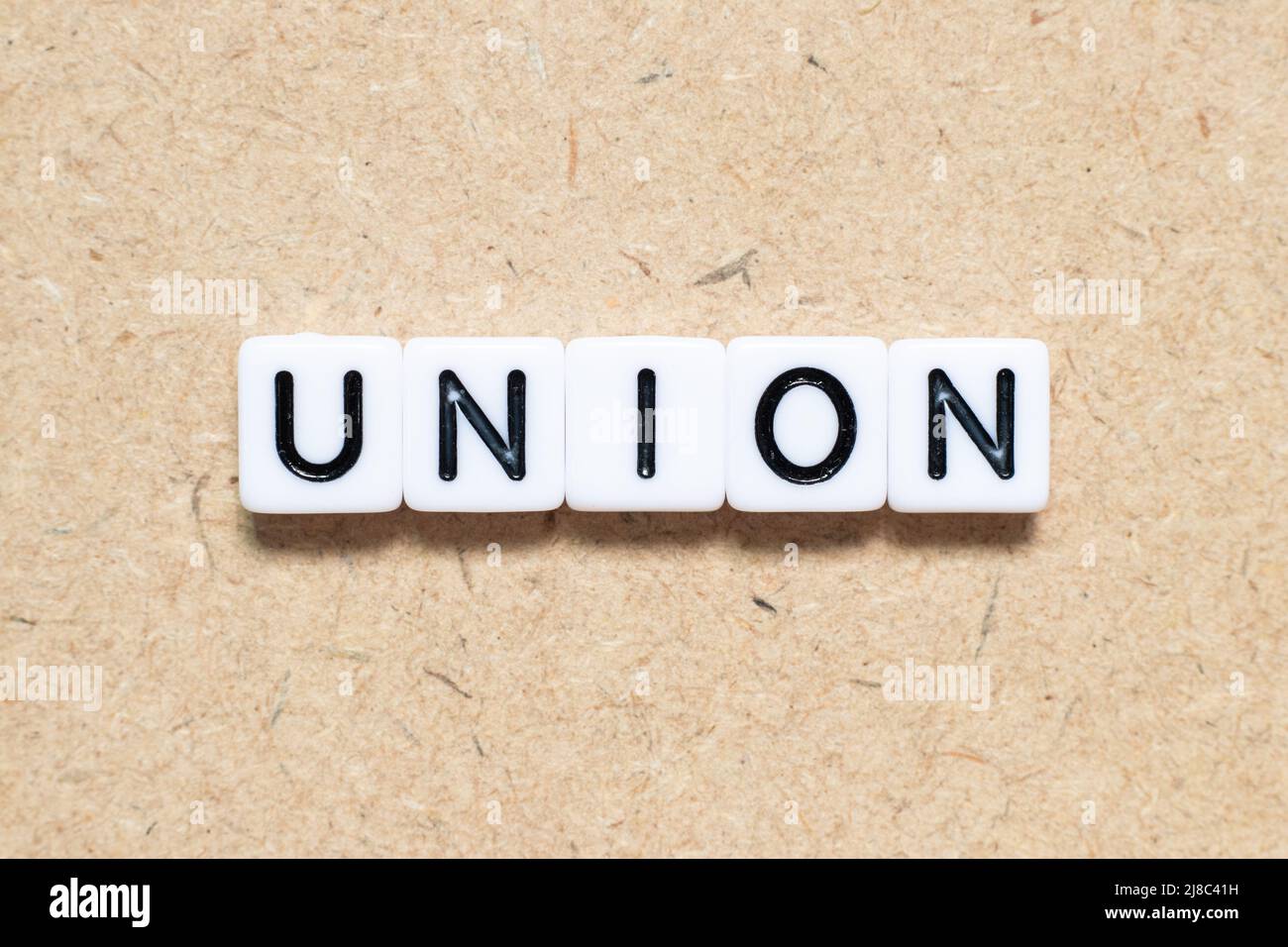 White tile alphabet letter with word union on wood background Stock ...
