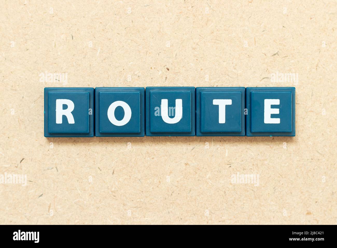 Tile alphabet letter in word route on wood background Stock Photo - Alamy