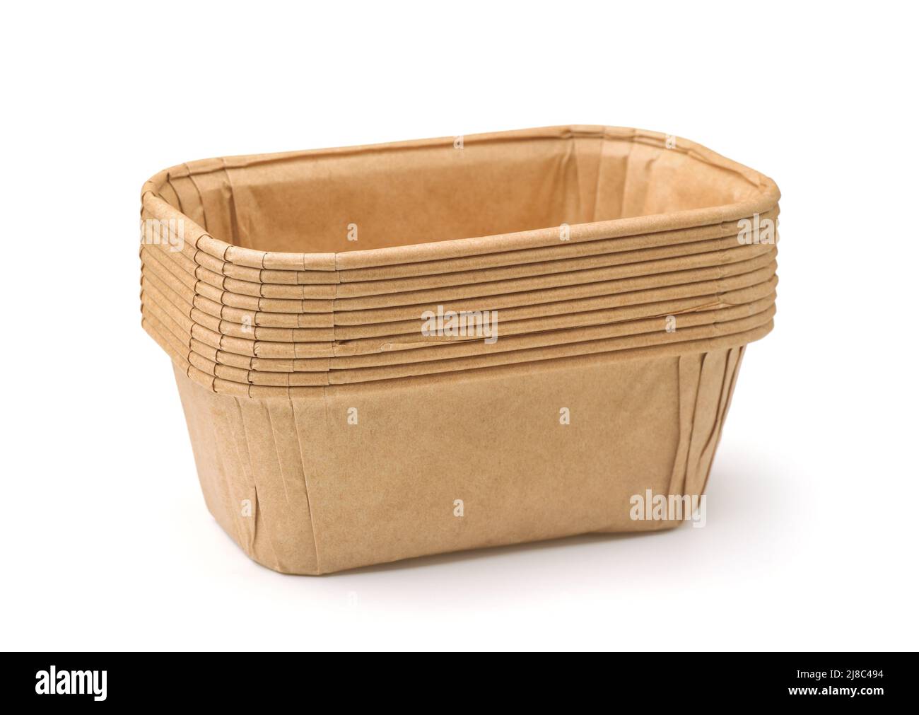 Stack of disposable rectangular brown paper baking molds isolated on ...