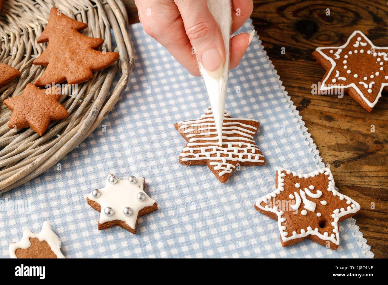 Decorating gingerbread cookies for christmas. Steps of making biscuits ...