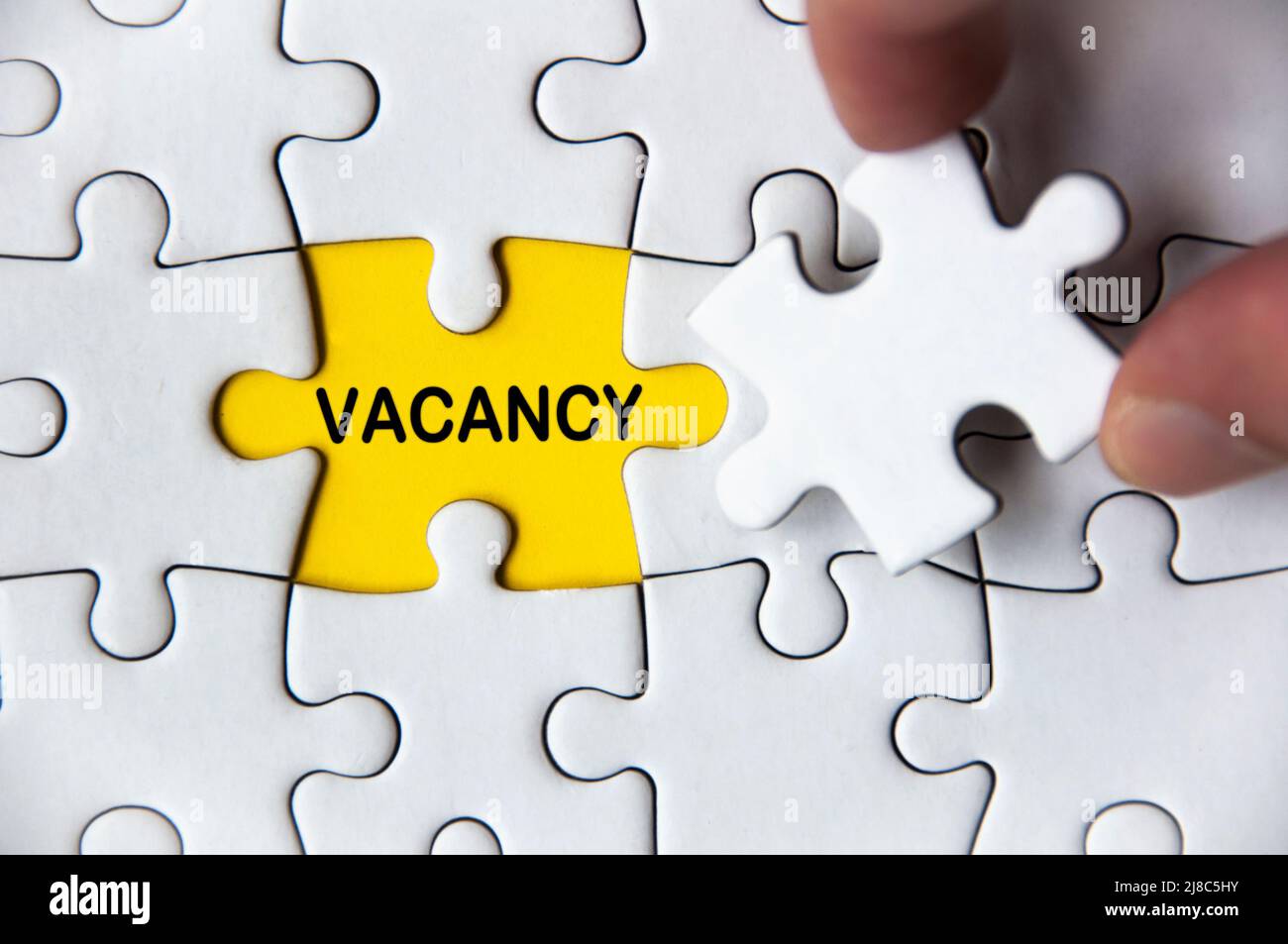 Vacancy text on missing jigsaw puzzle. Employment concept Stock Photo ...