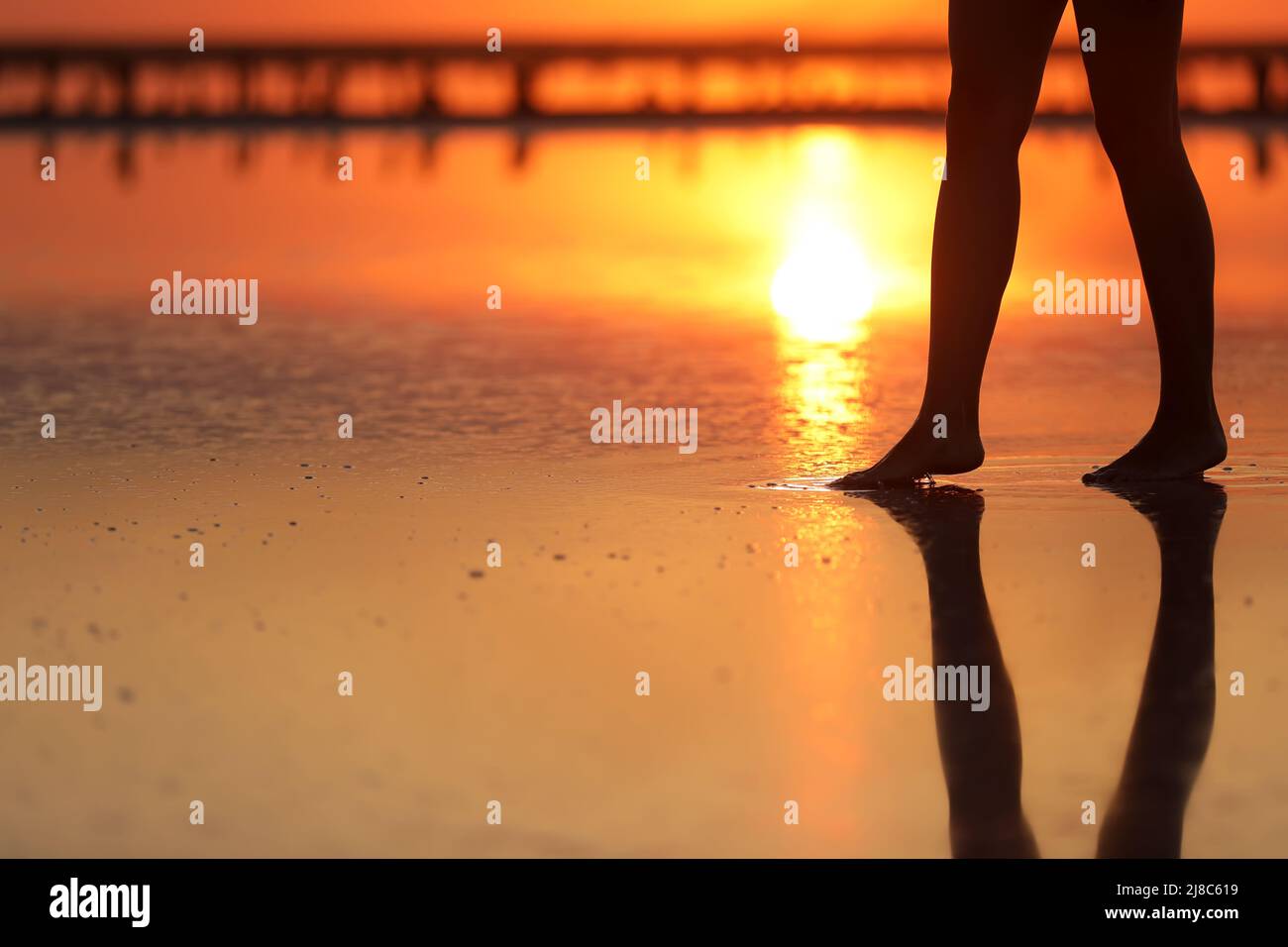 Side View Footage Of Beautiful Young Woman In The Swimsuit Walking On The Beach Towards The Sea