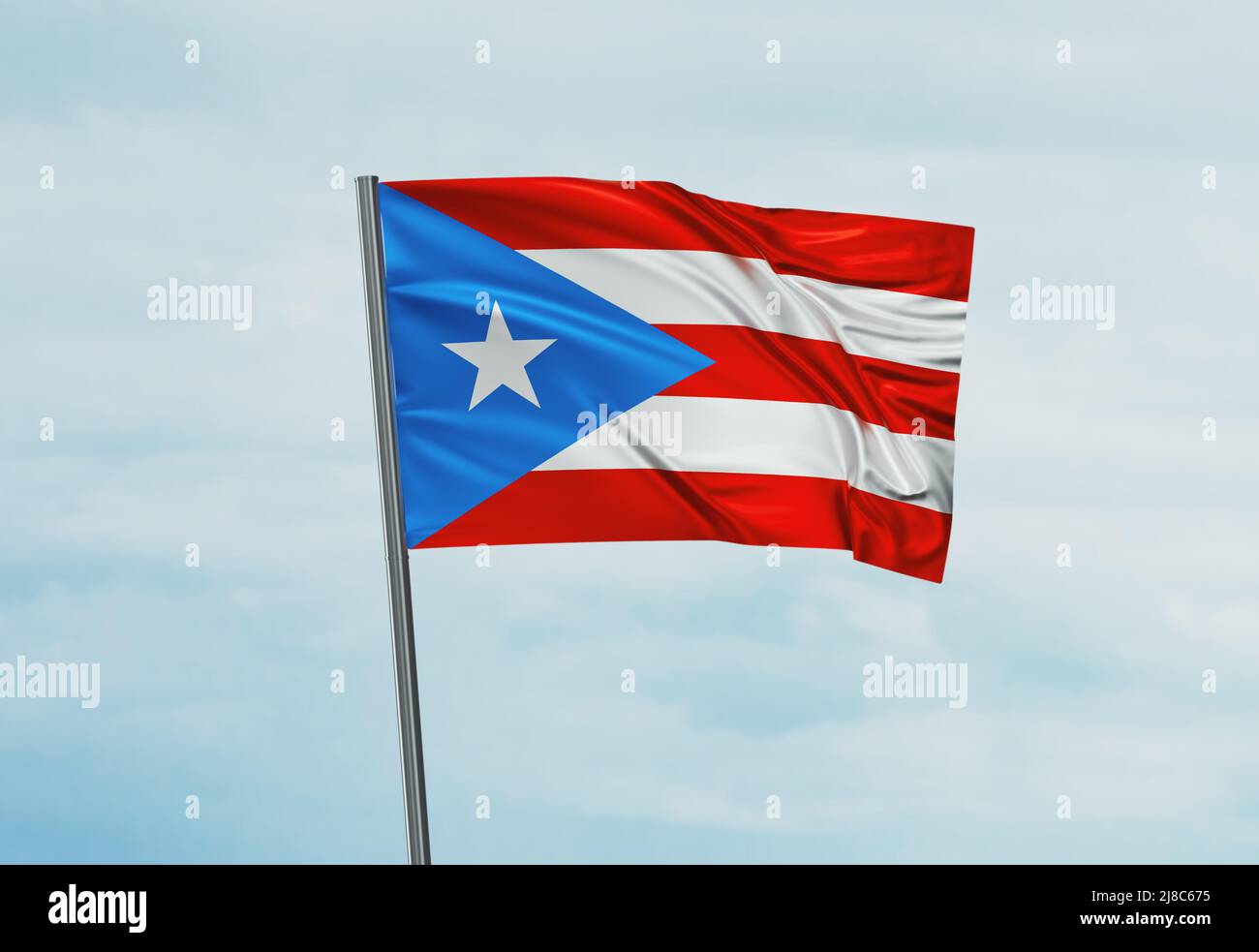 Puerto Rico national flag waving in the wind. Sky background 3D illustration Stock Photo - Alamy
