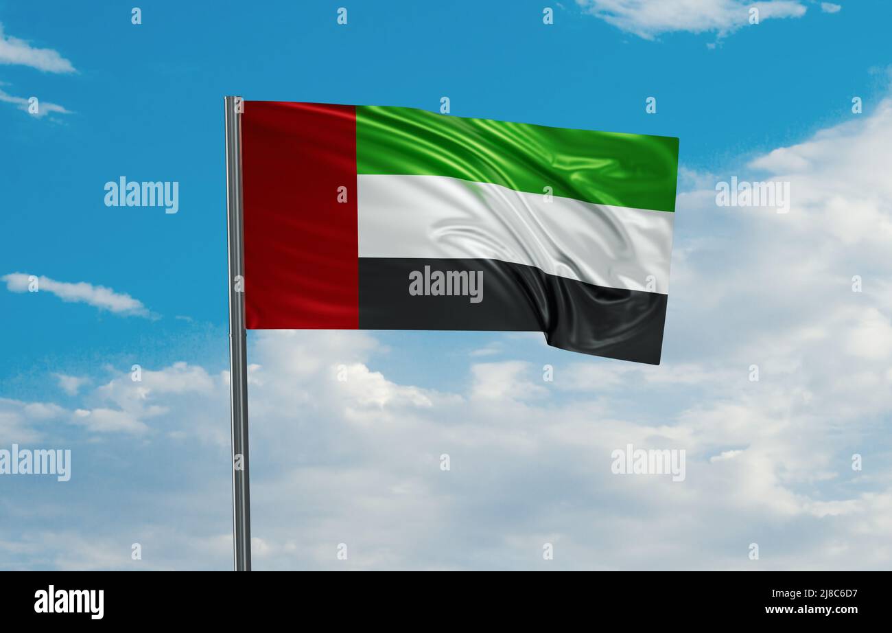 United Arab Emirates national flag waving in the wind. Sky background ...