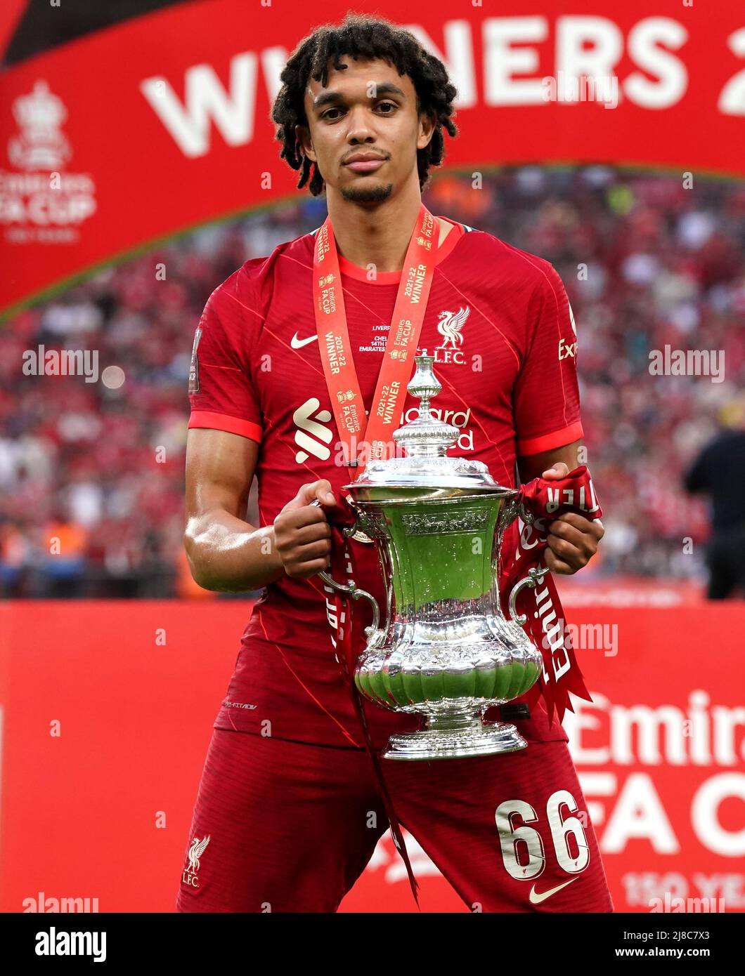 Liverpool's Trent Alexander-Arnold poses with the trophy after the ...