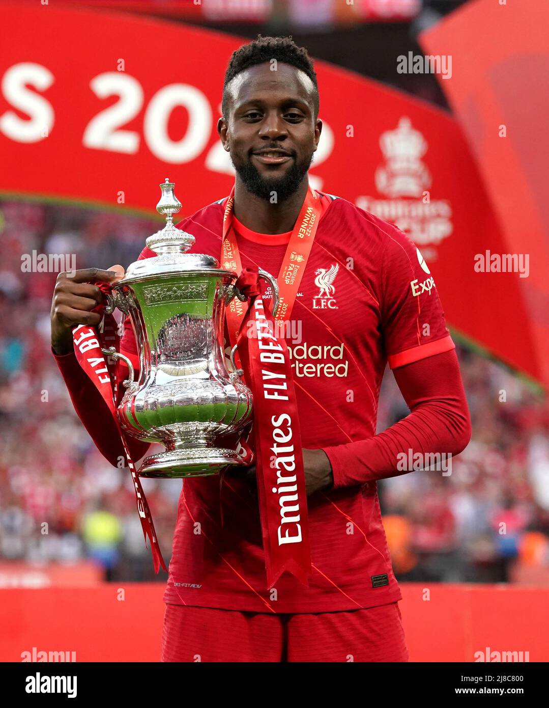 Liverpool's Divock Origi poses with the trophy after the Emirates FA ...